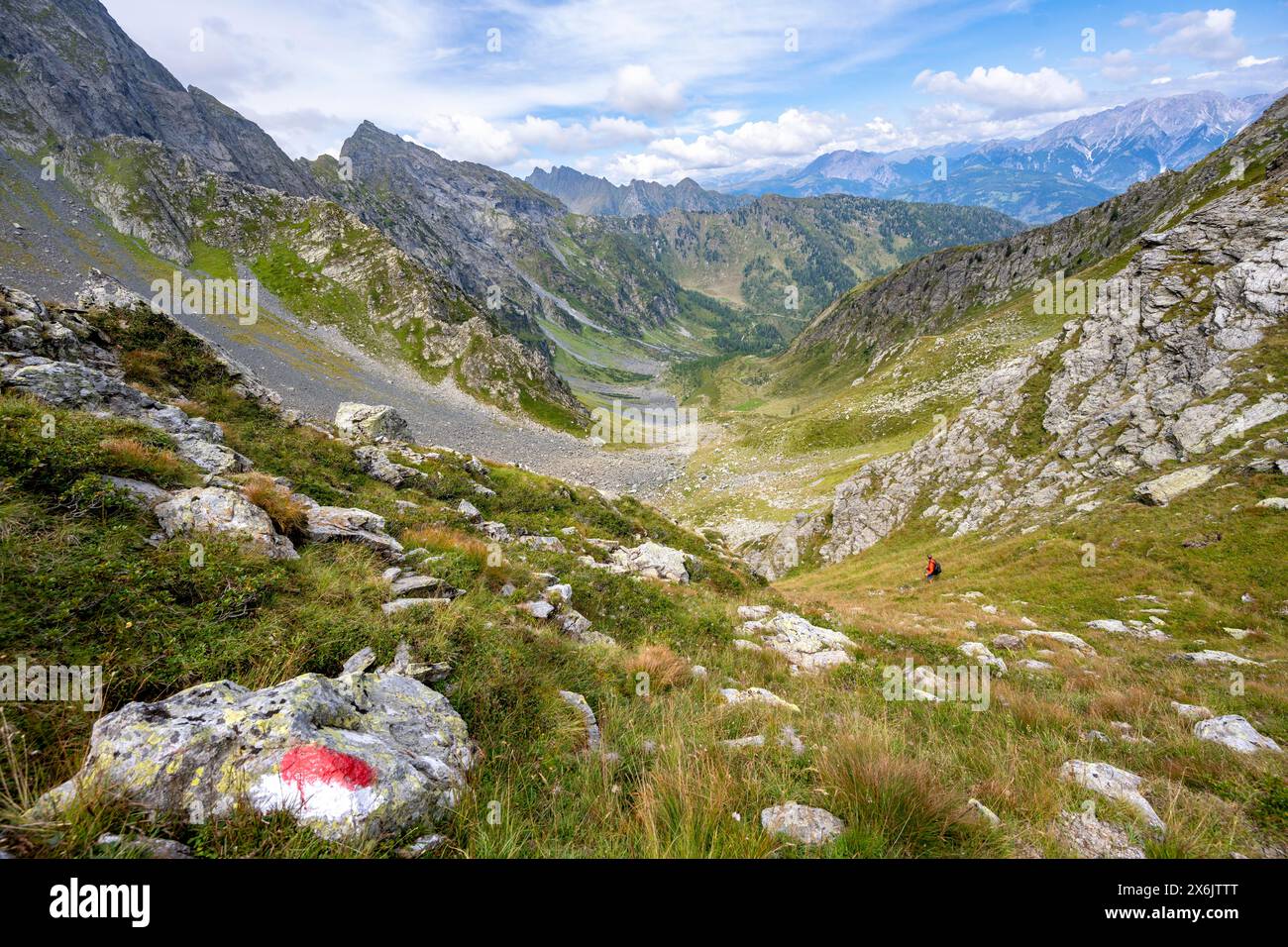 Mountaineer on a hiking trail at a saddle, view into the Obergailtal ...