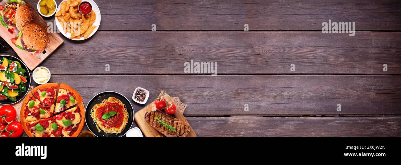 Corner border of a collection of delicious foods. Overhead view on a ...