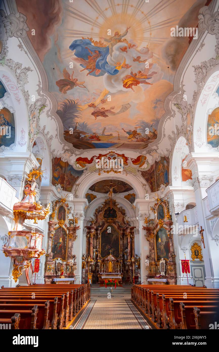 Interior of a baroque church with an elaborate ceiling fresco and a ... Interior of a baroque church with an elaborate ceiling fresco and a ...