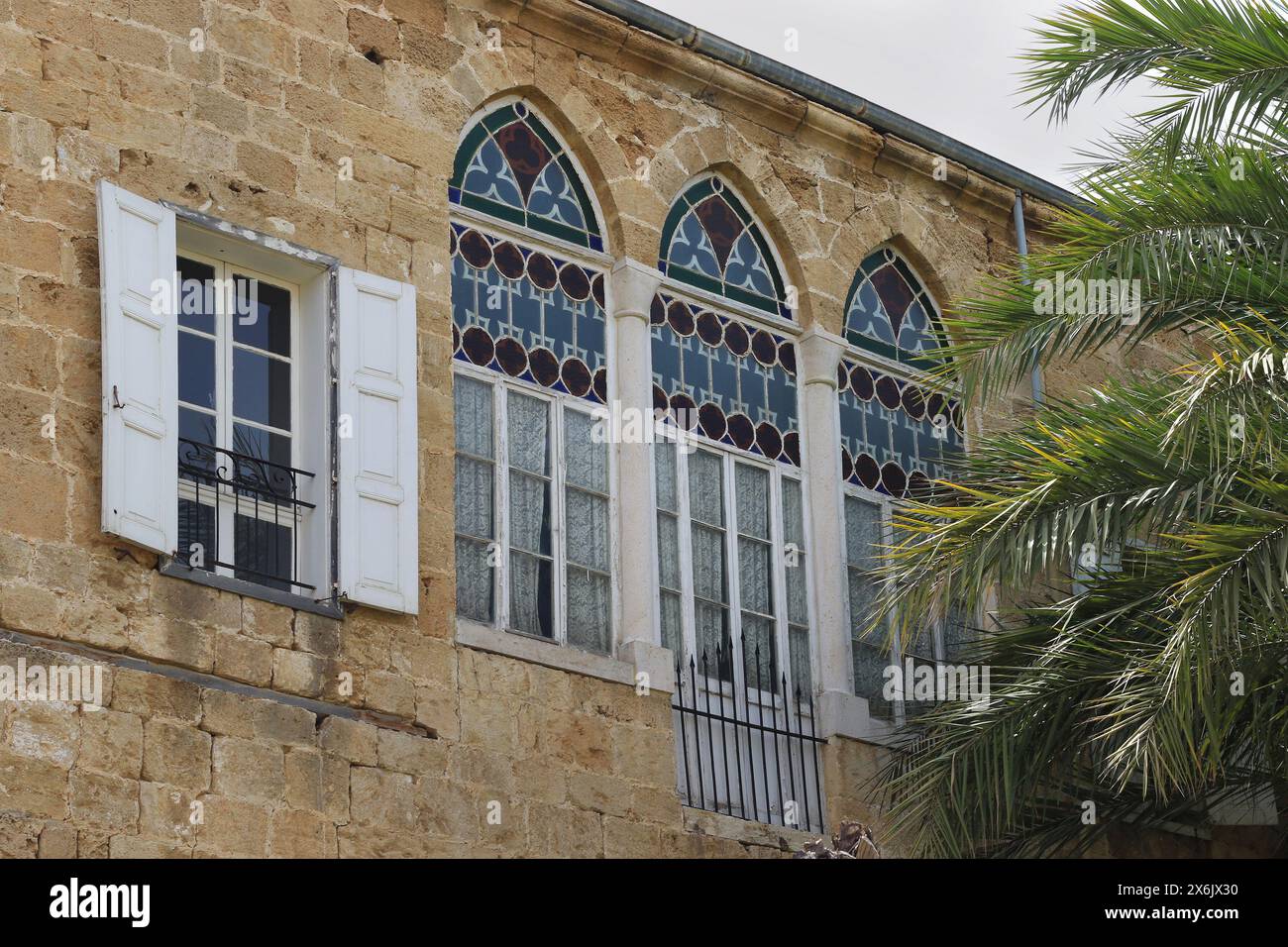Lebanese traditional windows with branches of a palm tree Stock Photo ...