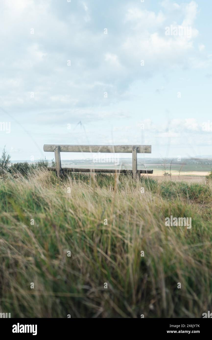View of a simple wooden fence against a peaceful scenic background ...