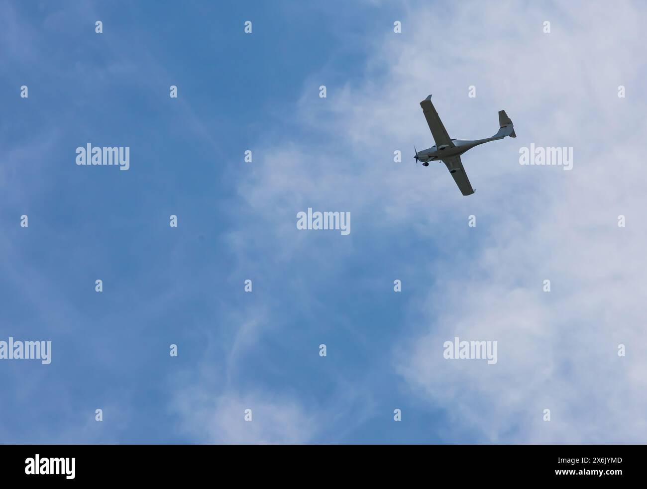 small plane flying low in the sky with space for text Stock Photo - Alamy