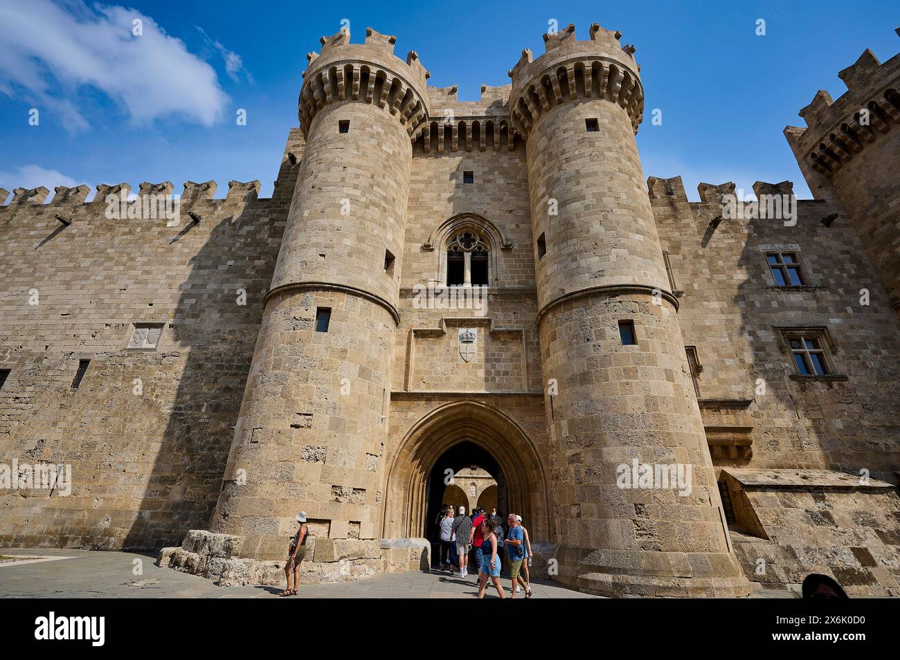 Super wide angle shot, travellers standing in front of an imposing ...