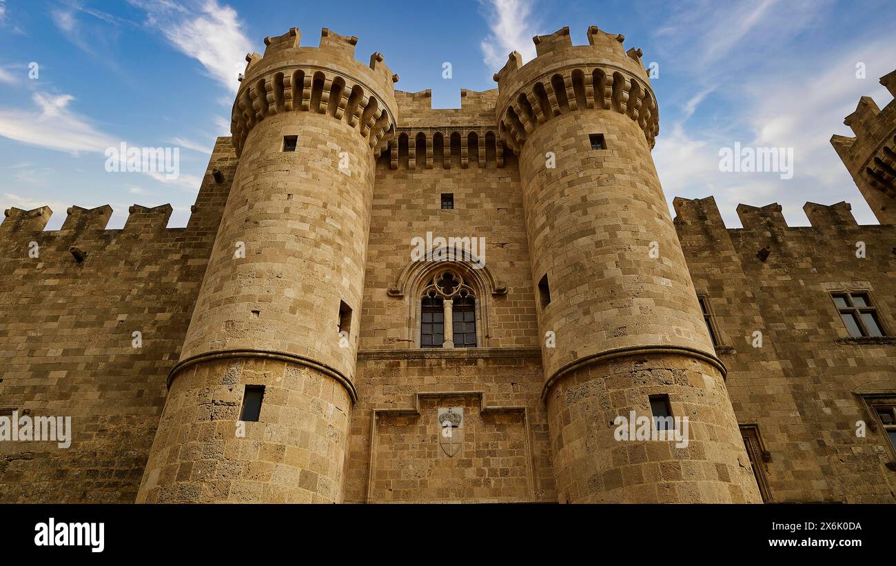 Detailed view of two tin towers of the castle in front of a cloudy sky ...