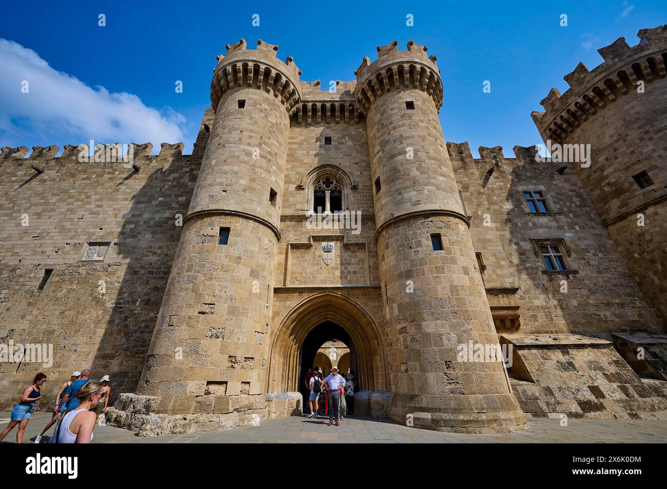 Super wide angle shot, group of visitors approaching the entrance of a ...