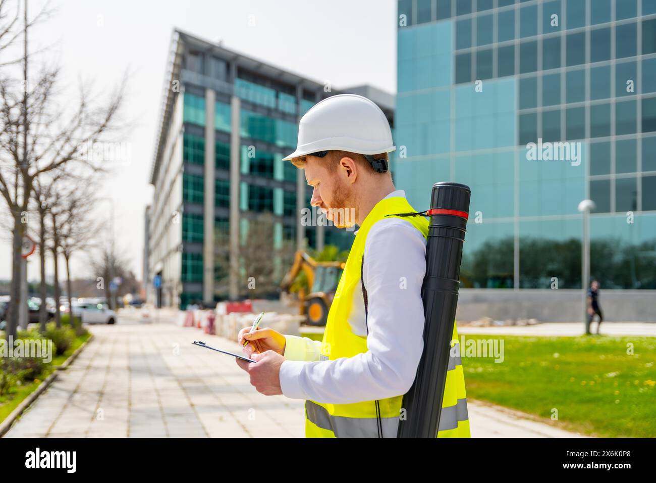 Horizontal photo with copy space of an engineer working writing notes ...