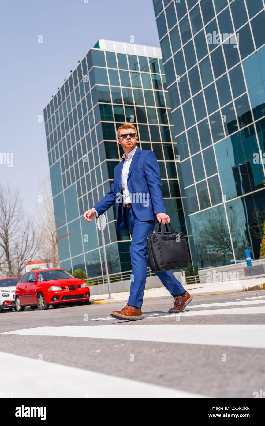 Businessman crossing hi-res stock photography and images - Alamy