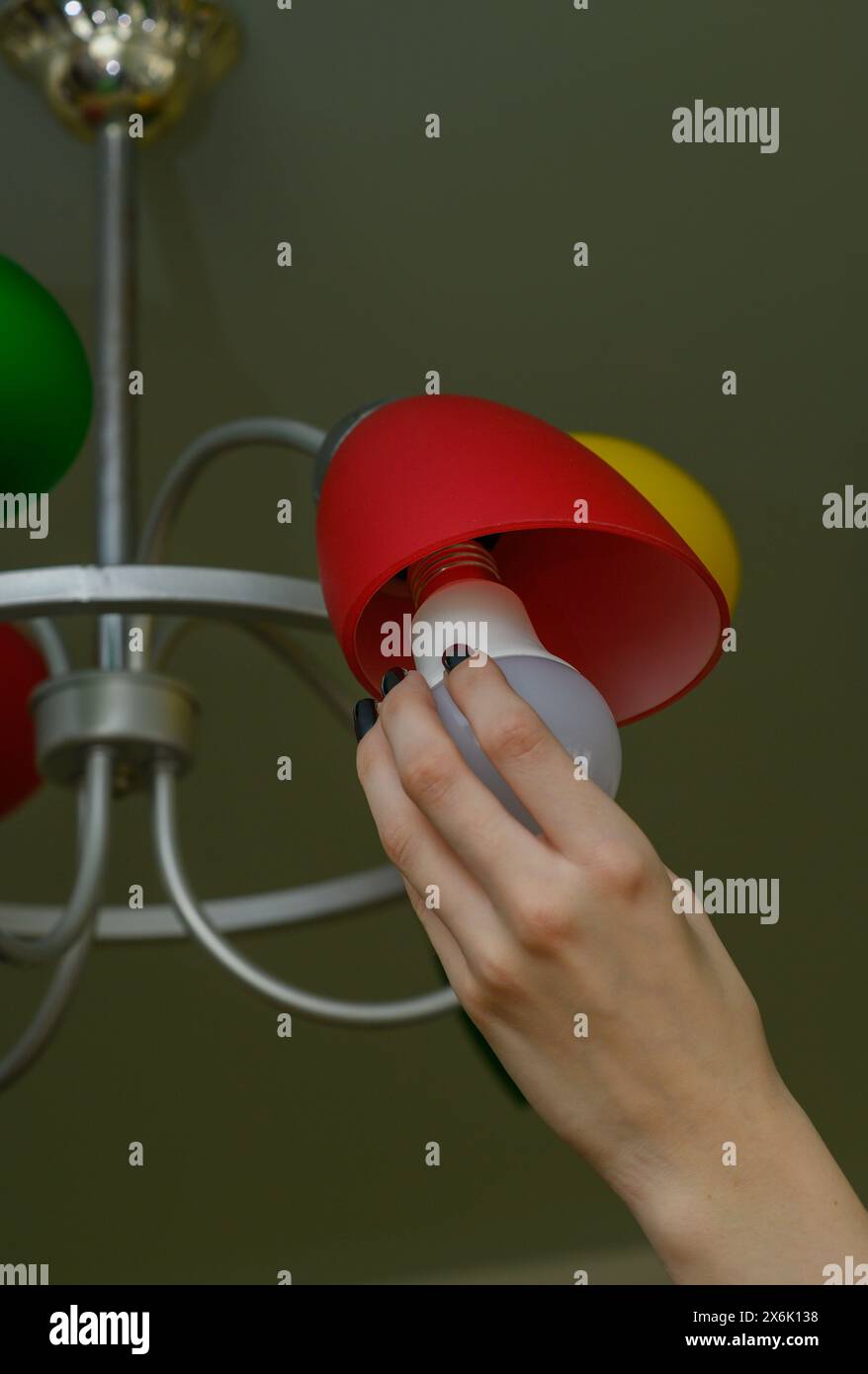 replacing the LED light bulb in the lamp Stock Photo - Alamy