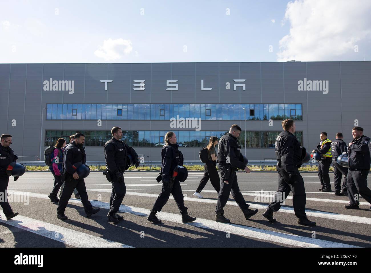 Police officers in front of the Tesla Gigafactory at the demonstration ...