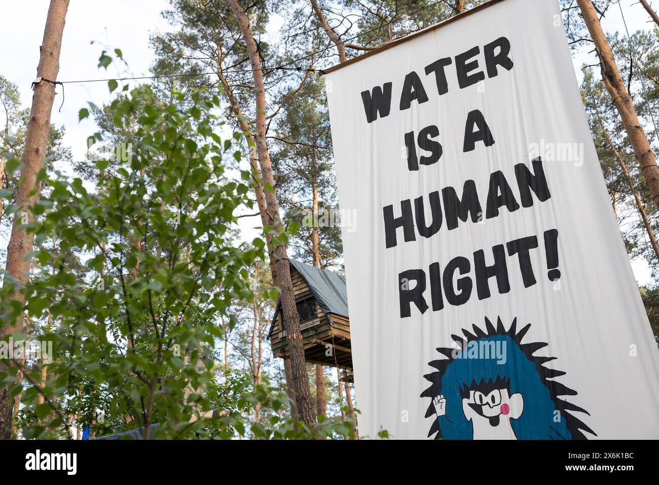 Tree houses and banners Water is a human right! (Water is a human right ...