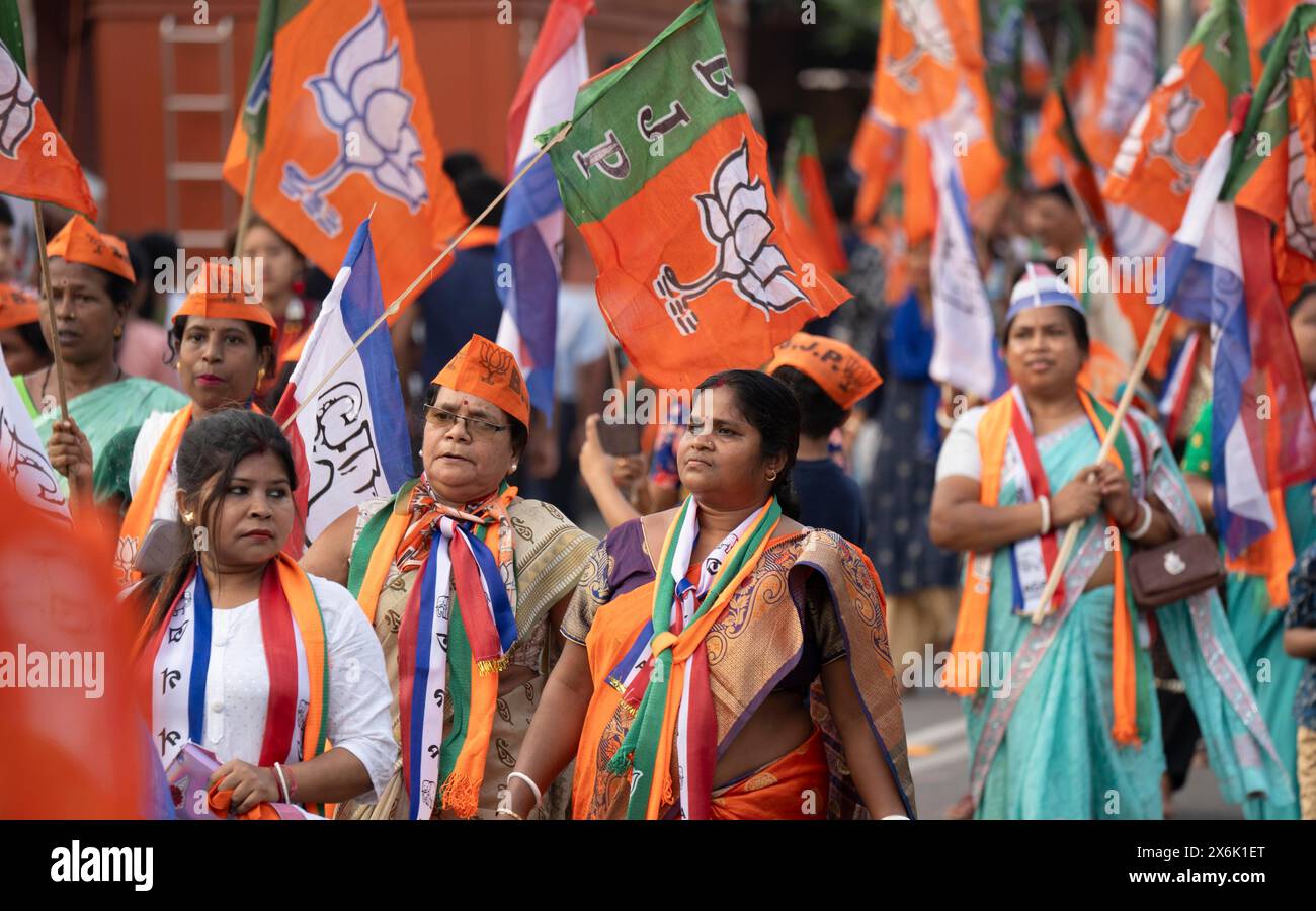 Bharatiya Janata Party (BJP) supporters holding BJP flags arrives to to ...