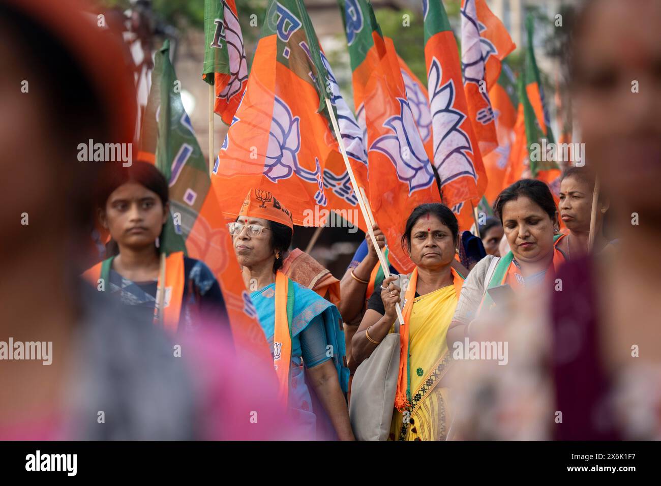 Bharatiya Janata Party (BJP) supporters holding BJP flags arrives to to ...