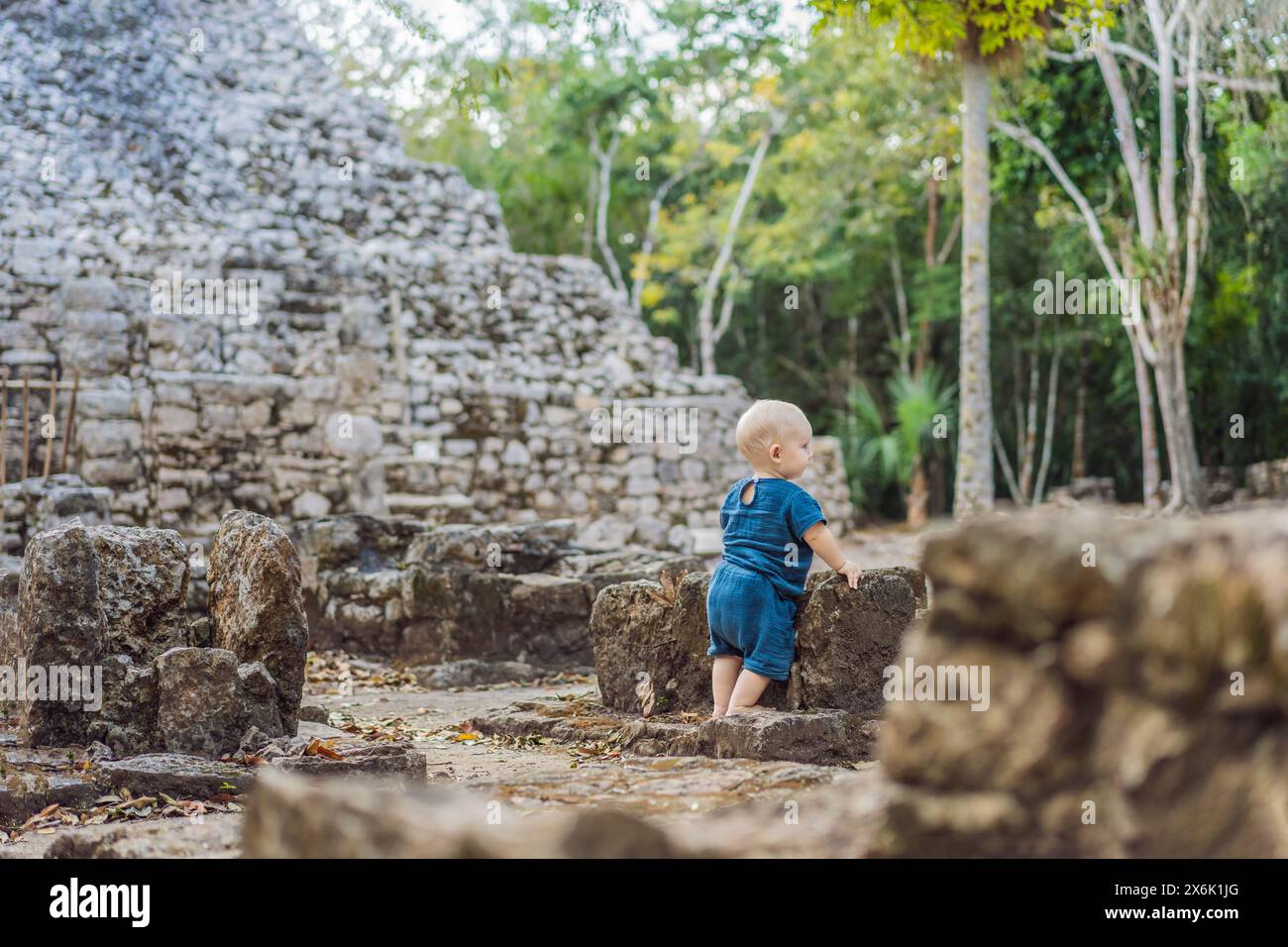 Baby tourist at Coba, Mexico. Ancient mayan city in Mexico. Coba is an ...