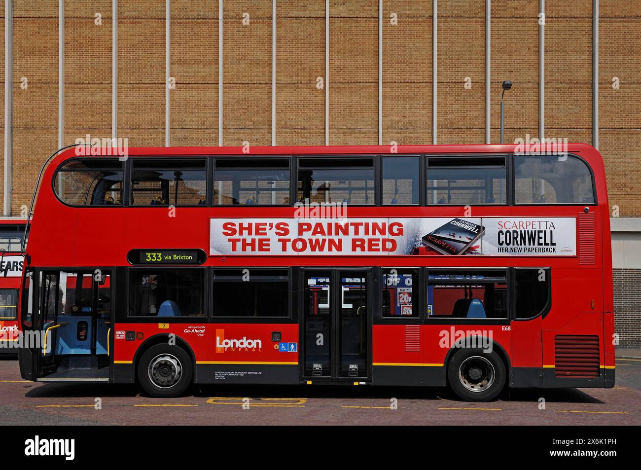 Red English double-decker bus at the bus stop, Tooting Broadway, London ...