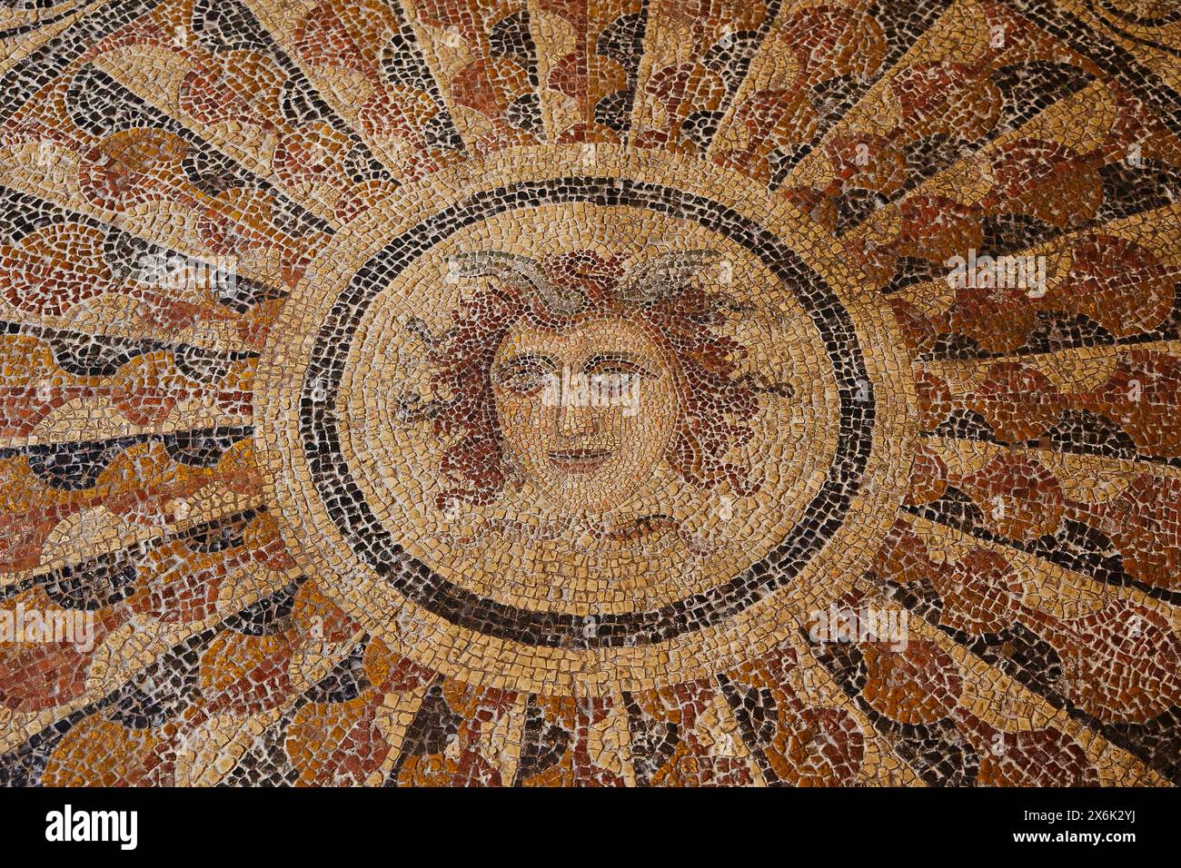 Detailed antique mosaic of a female face representing the sun, head of ...
