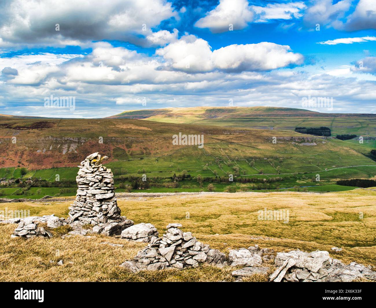 A line of ancient stone cairns on top of the hills in Littondale in the ...