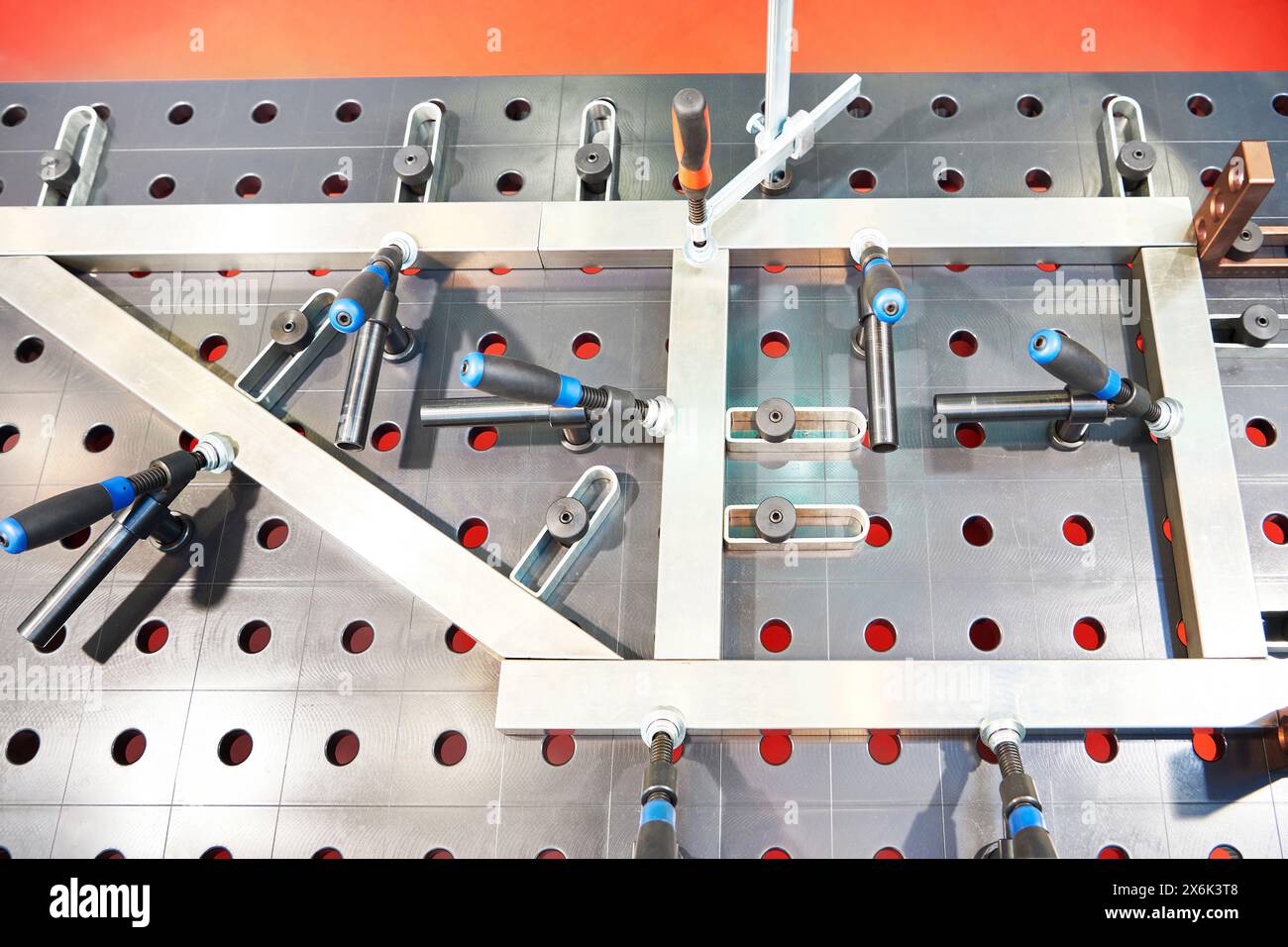 Table with clamps for welding at industrial exhibition Stock Photo - Alamy