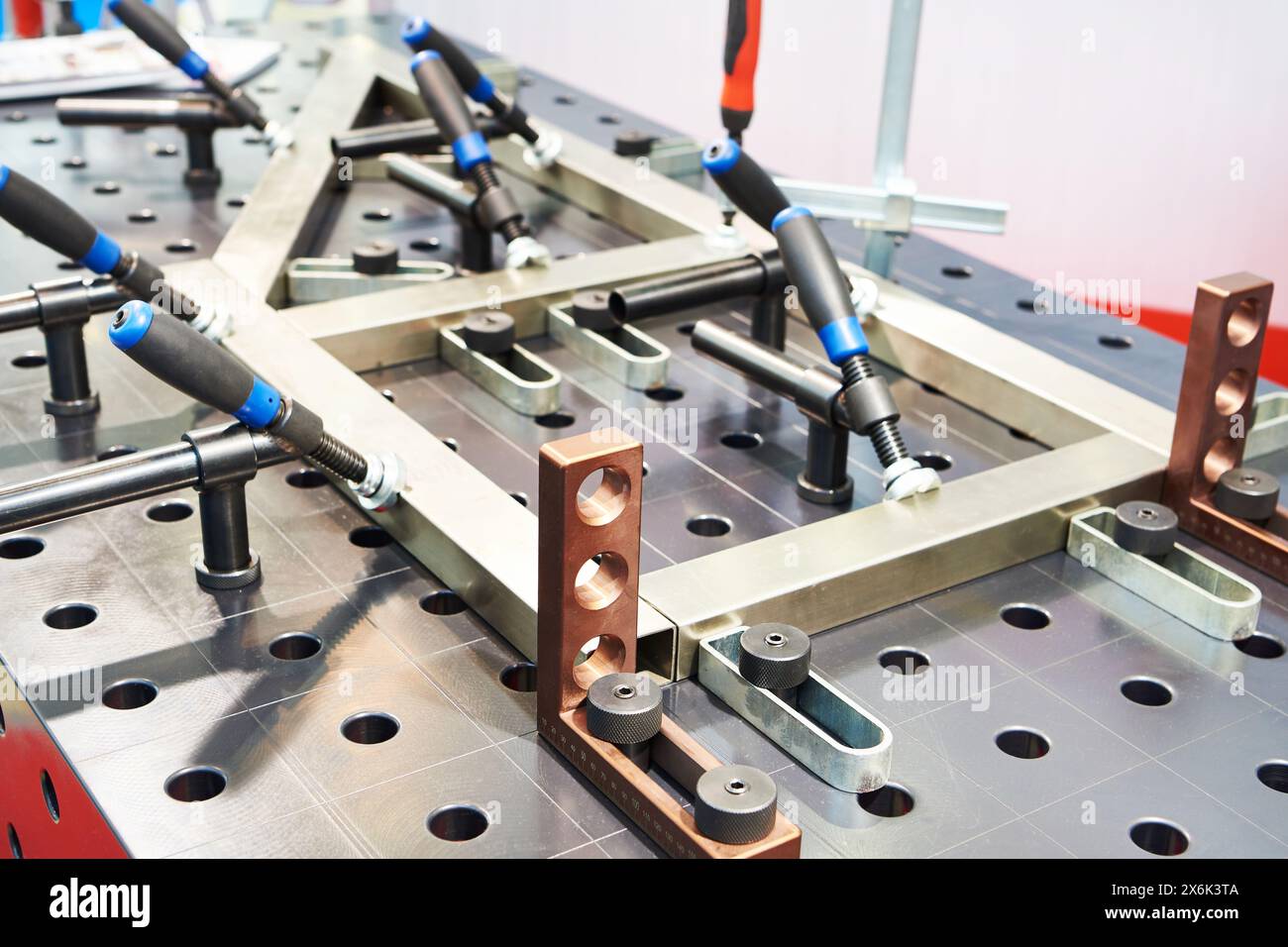 Table with clamps for welding at industrial exhibition Stock Photo - Alamy