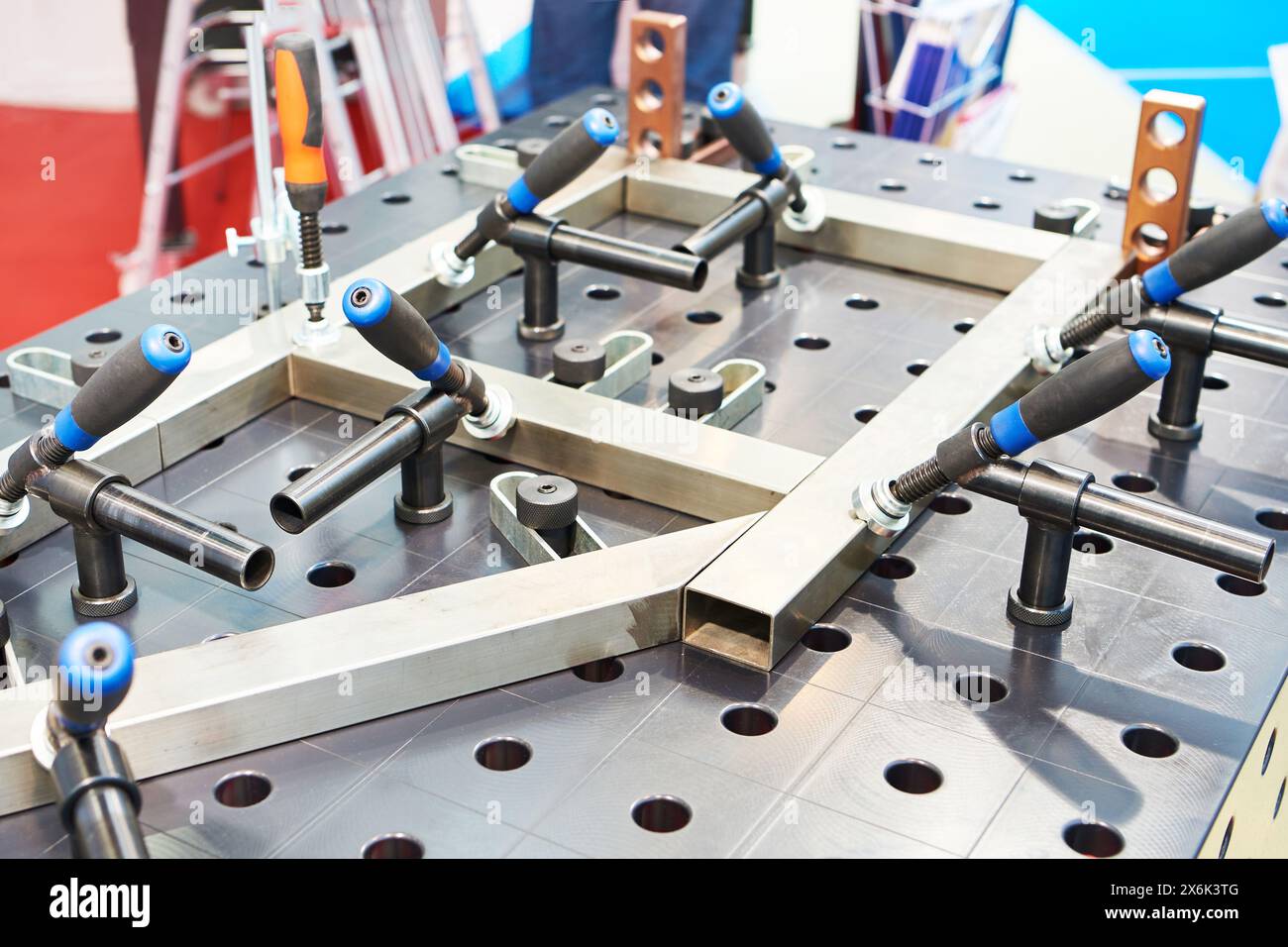 Table with clamps for welding at industrial exhibition Stock Photo - Alamy