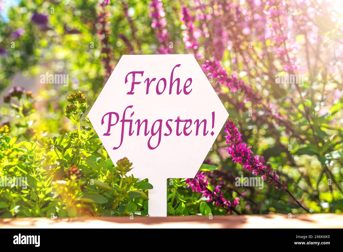 15 May 2024: Happy Whitsun Symbolic image of Pentecost. Sign in front ...