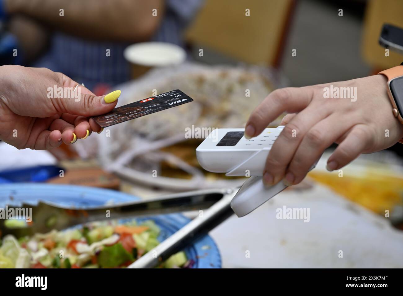 Payment by tap and go credit card Stock Photo - Alamy