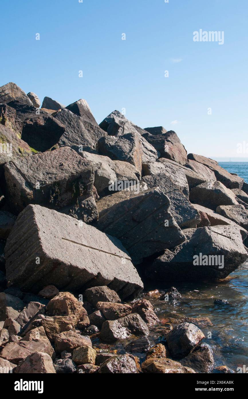 large rocks boulders form the new sea defences along the foreshore ...