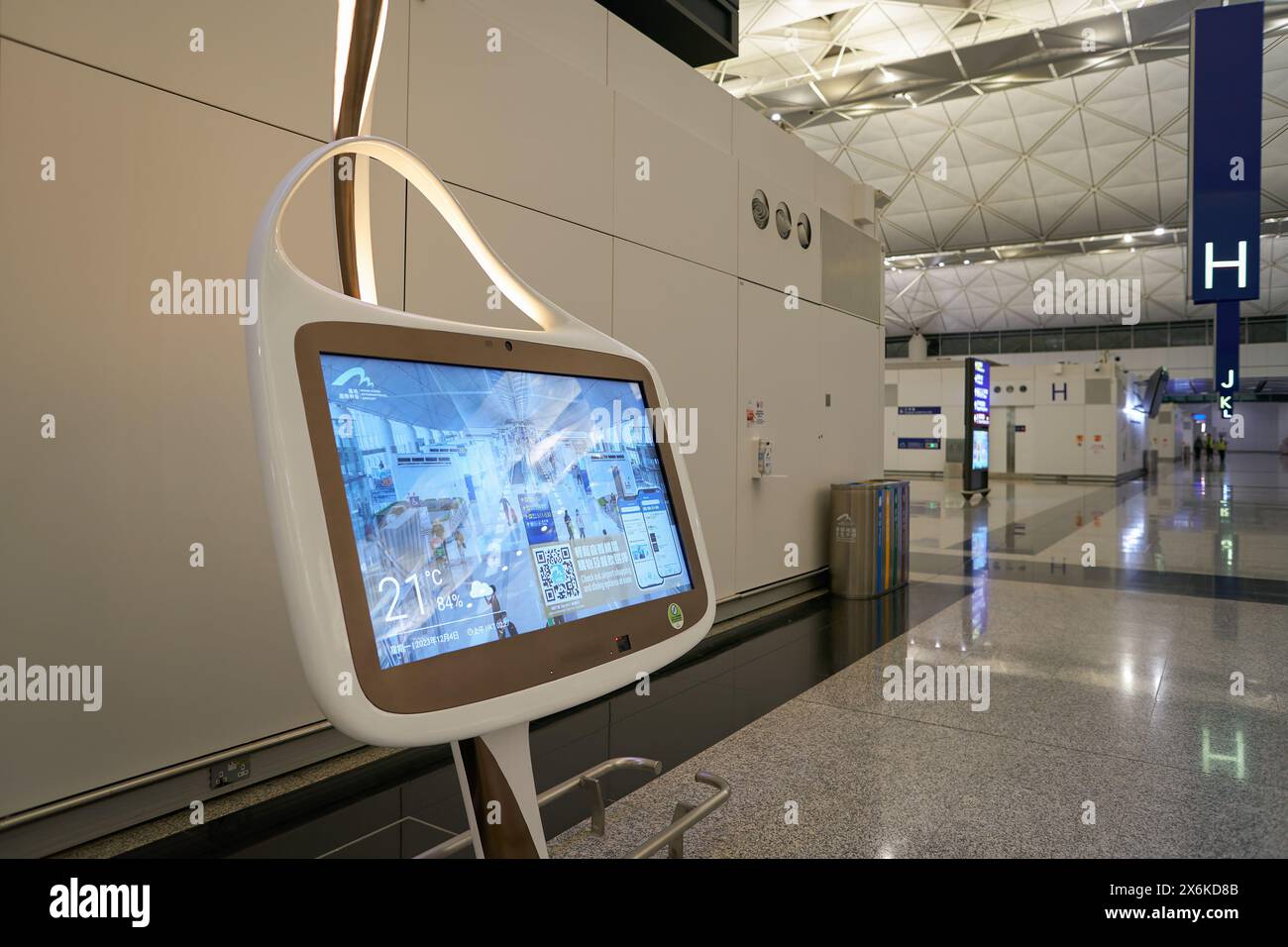 HONG KONG, CHINA - DECEMBER 04, 2023: interactive self service information kiosk at check-in ...