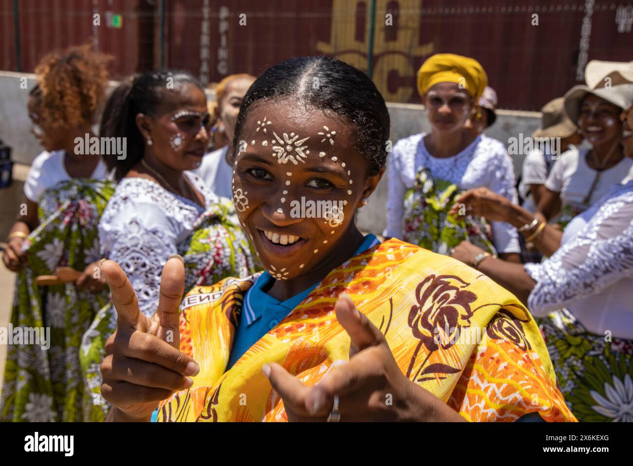 Happy local woman with Masonjoany decorative face painting during a ...