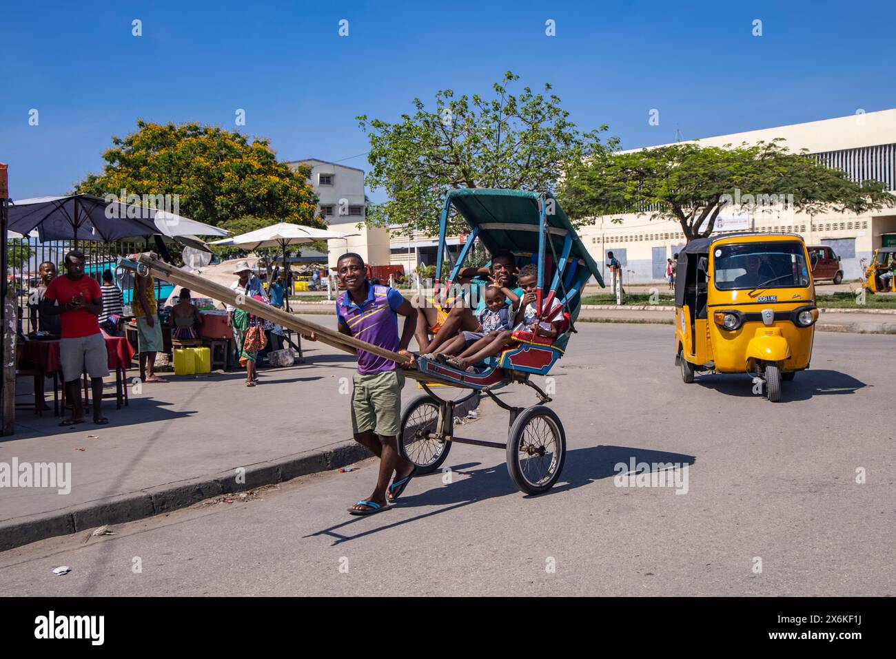 Human powered rickshaw with family inside, Mahajanga, Boeny, Madagascar ...