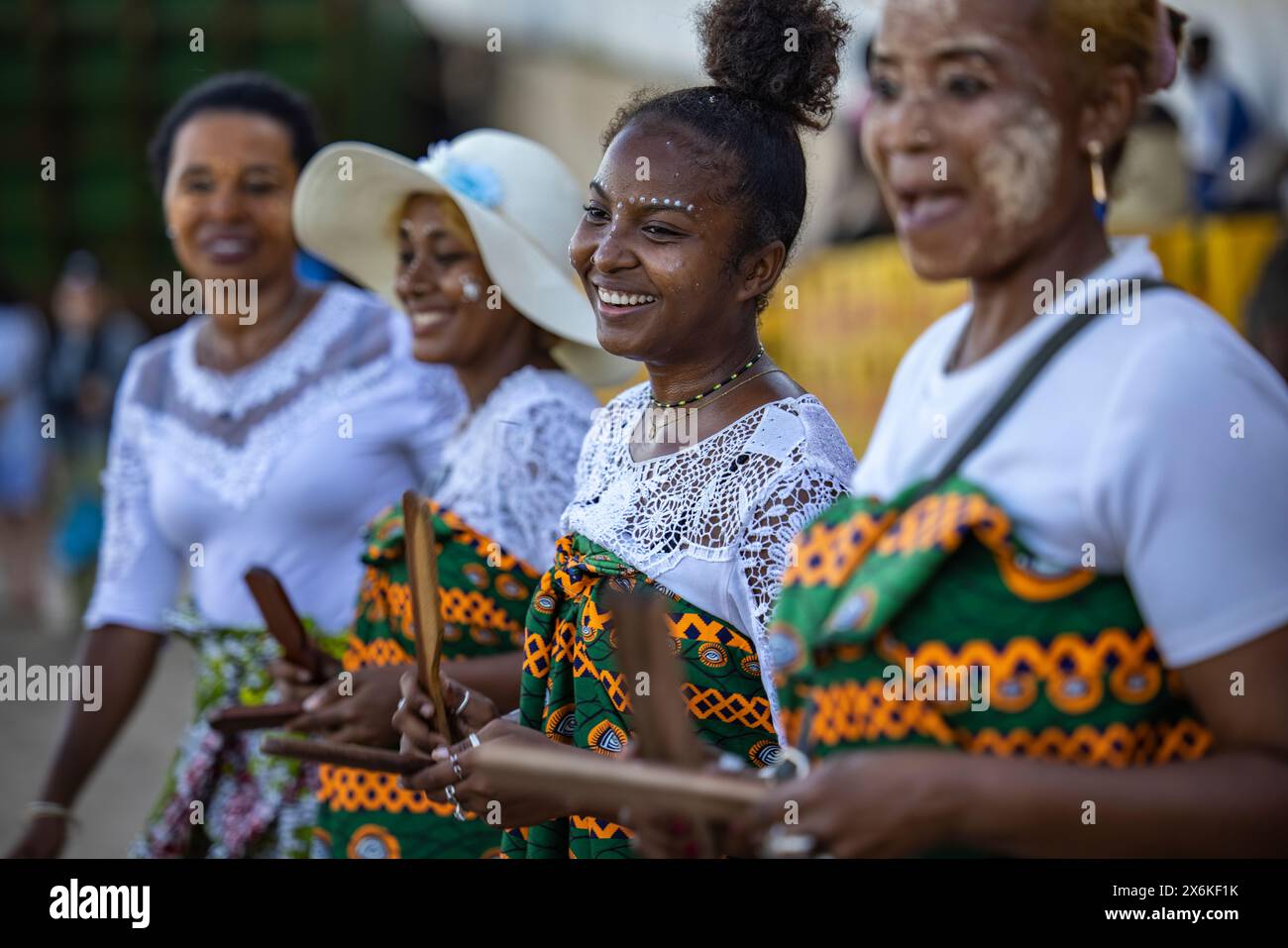Happy women with Masonjoany decorative face paint during a traditional ...