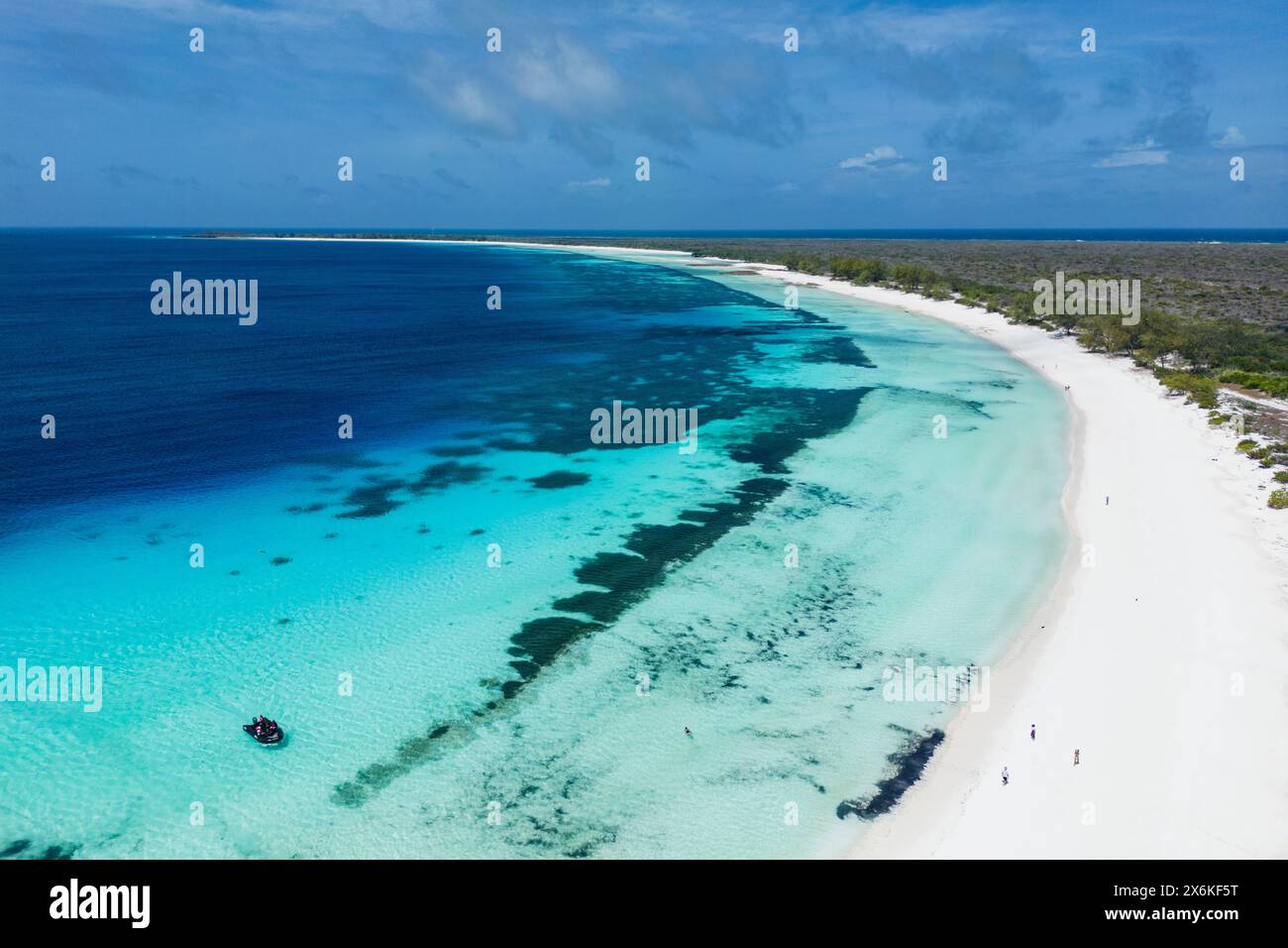 Aerial view of people walking on the beach, Assumption Island, Outer ...
