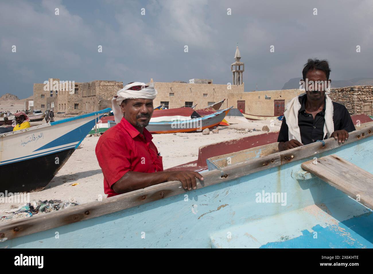 Local men and fishing boats on the beach, Qalansiyah, Socotra Island ...