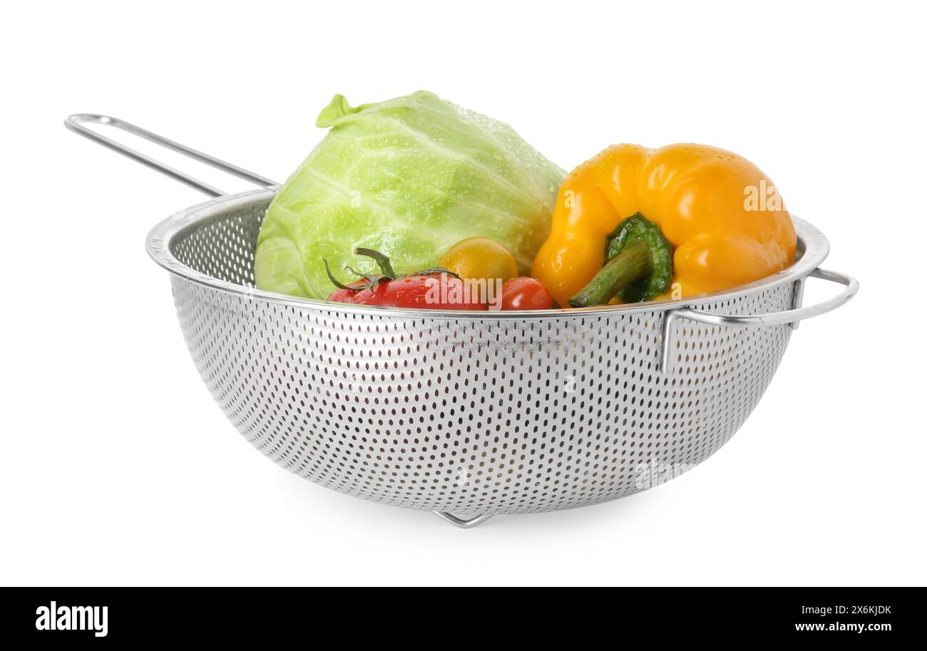 Metal colander with different wet vegetables isolated on white Stock ...