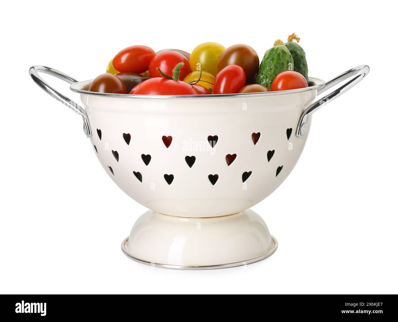 Metal colander with different tomatoes and cucumbers isolated on white ...