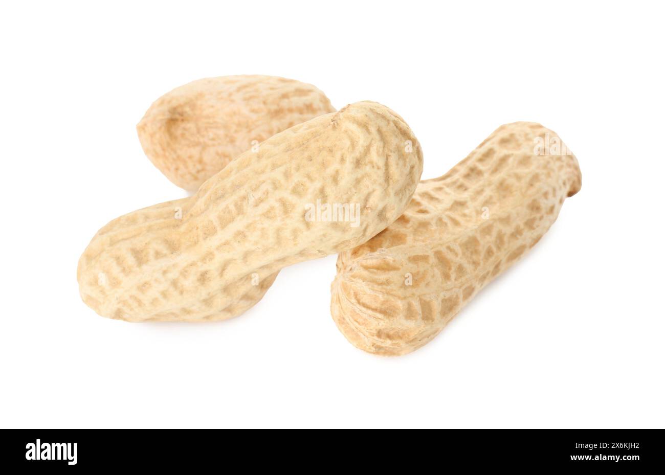 Three fresh unpeeled peanuts isolated on white Stock Photo - Alamy