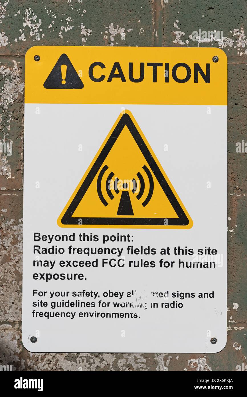 yellow white and black caution high radio frequency fields warning sign ...