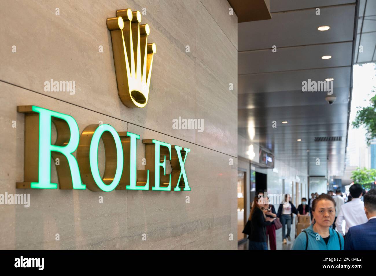 Pedestrians walk past the Swiss luxury watchmaker Rolex branch store in ...