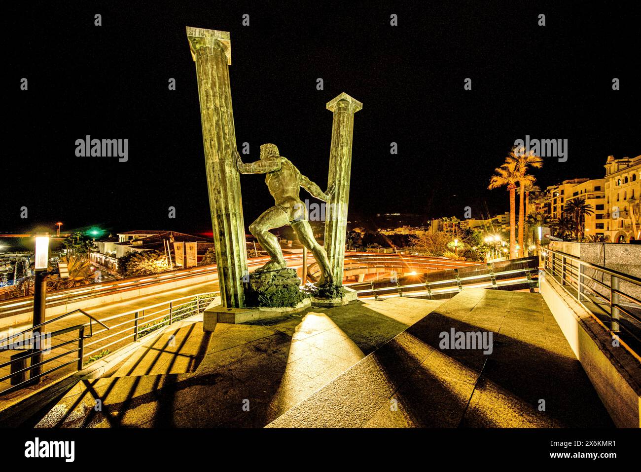 Statue of the Pillars of Hercules on the seafront of Ceuta at night in ...