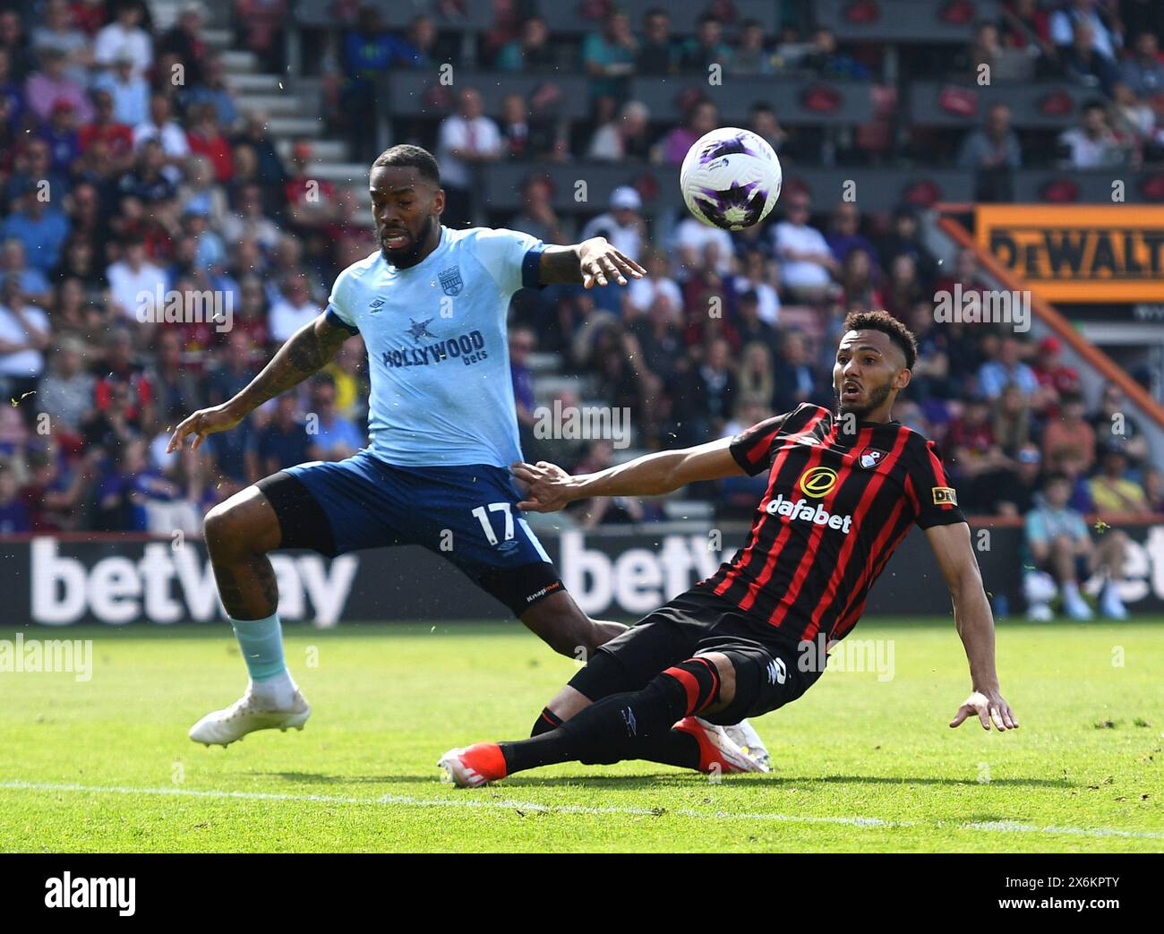 Ivan Toney of Brentford and Lloyd Kelly of AFC Bournemouth compete for ...