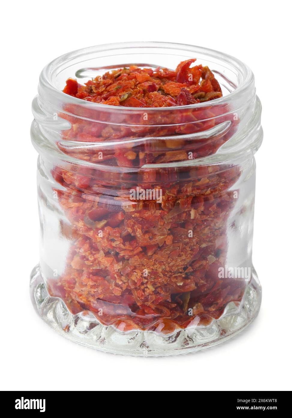 Aromatic spice. Red chili pepper flakes in jar isolated on white Stock ...