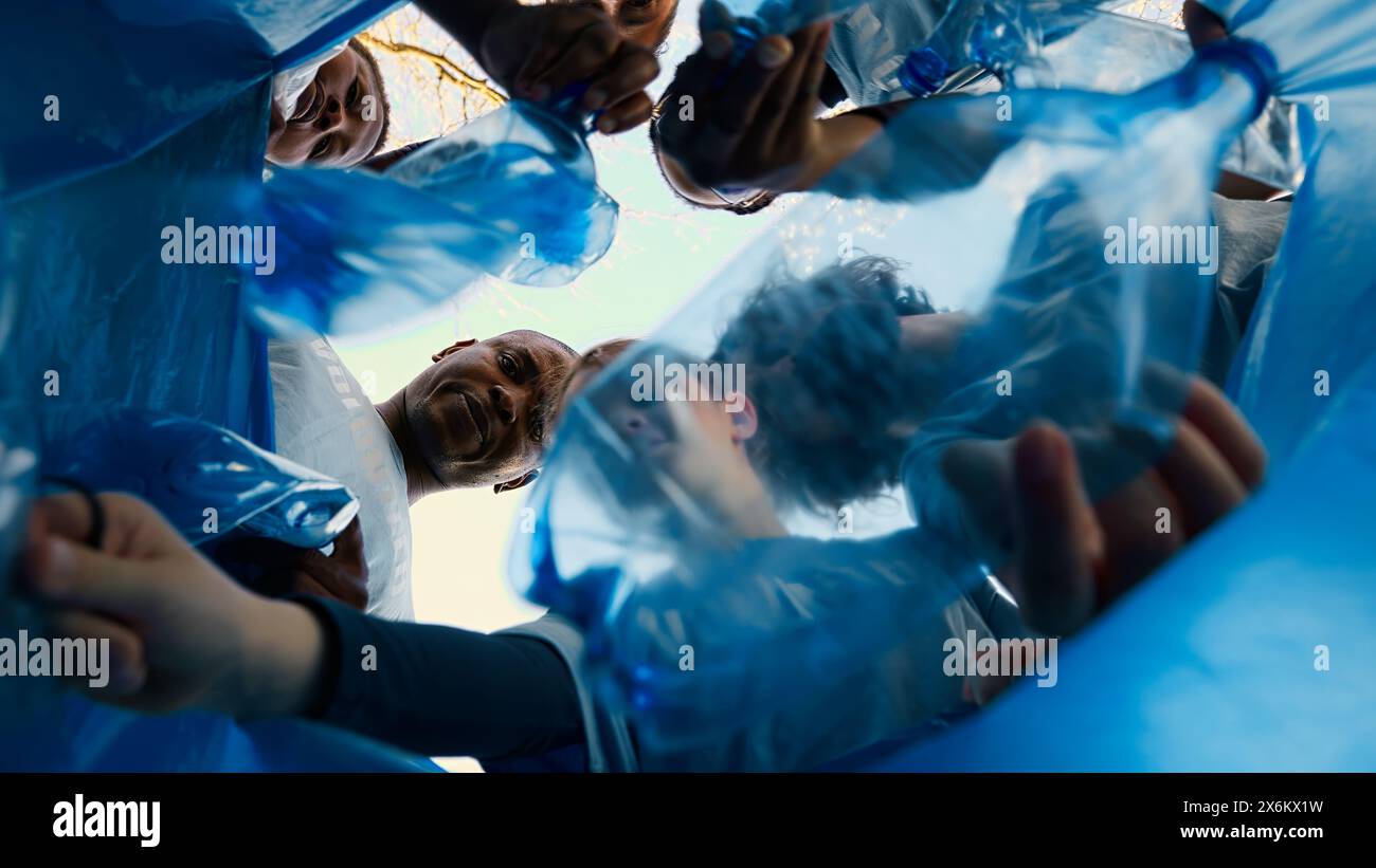 POV of community service team reduces waste and cleans up woods setting ...