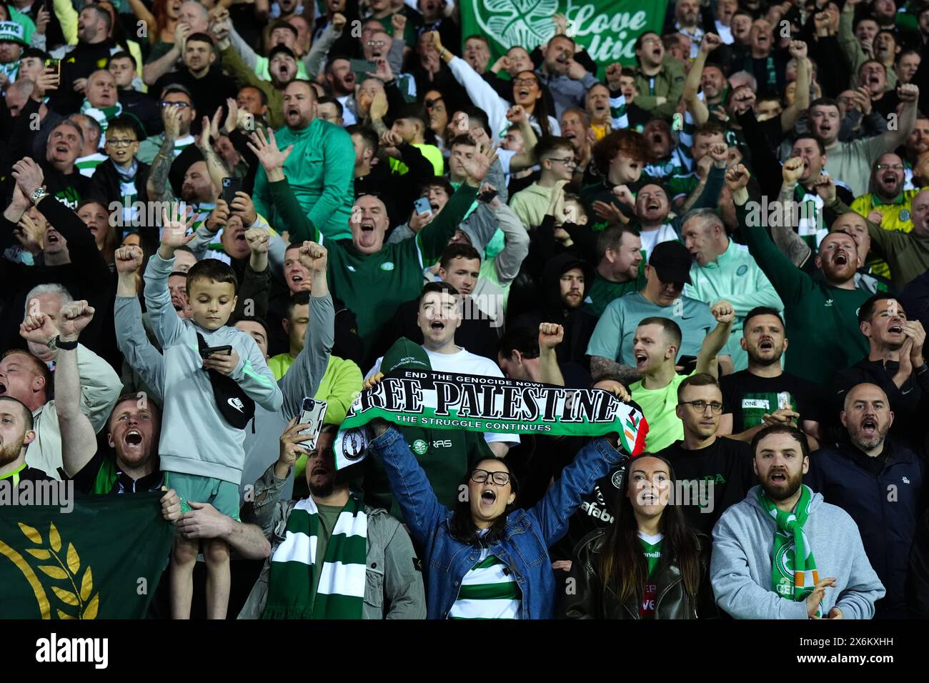 Celtic fans celebrate in the stands after clinching the title following ...