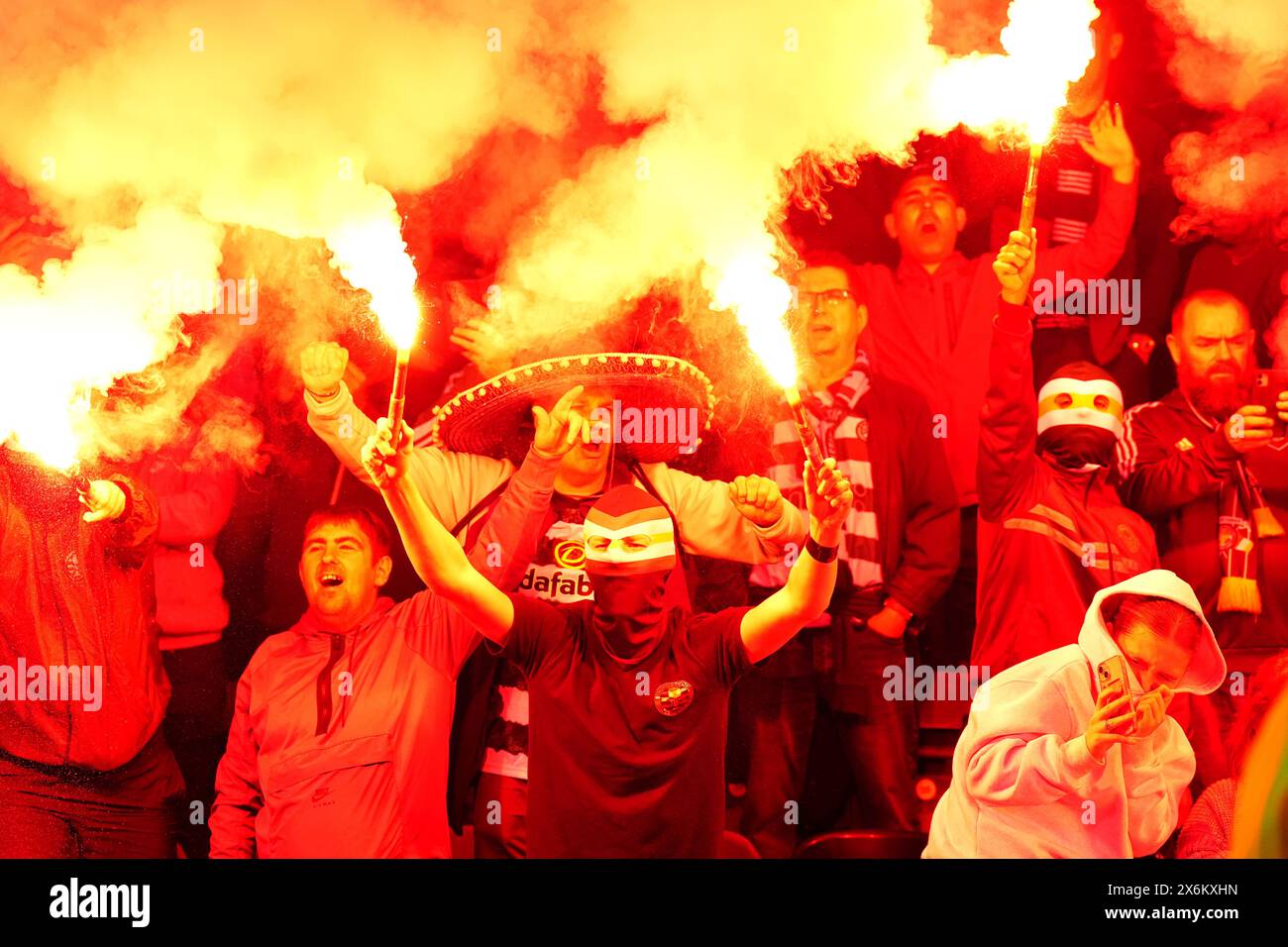Celtic fans celebrate in the stands after clinching the title following the cinch Premiership ...