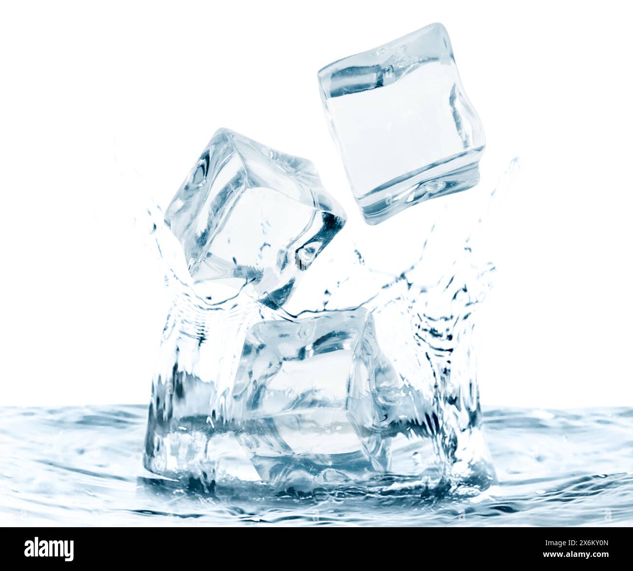 Ice cubes falling into water on white background Stock Photo - Alamy