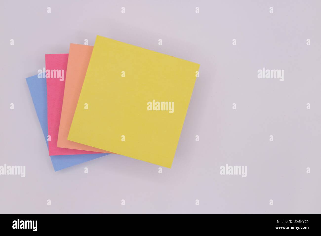 Post Notes colorful on white background isolated yellow peach pink blue ...