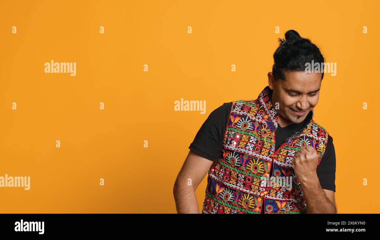 Portrait of narcissistic cheerful indian man celebrating and bragging ...