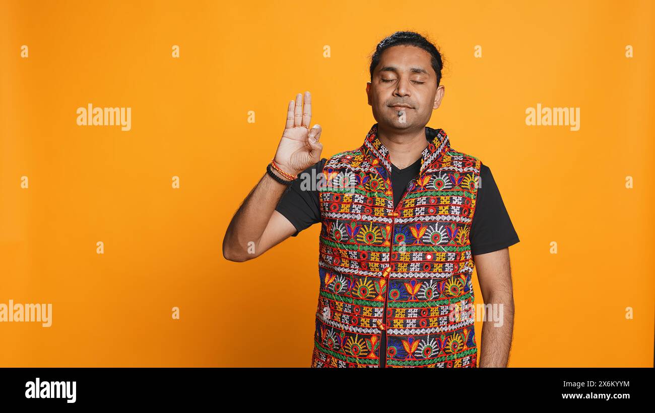 Indian man doing ok hand sign, feeling pleased, agreeing with ...