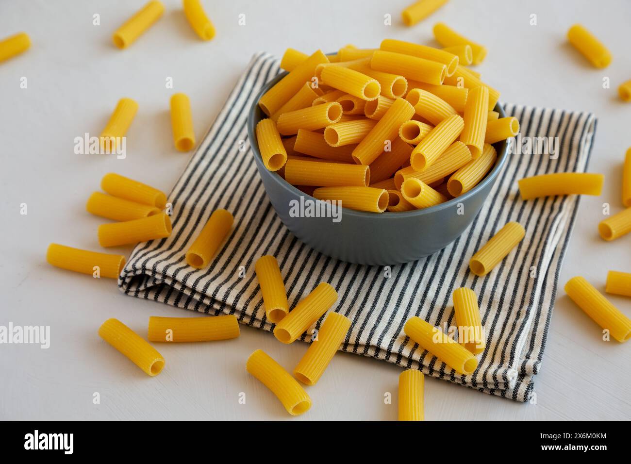 Dry Rigatoni Pasta in a Bowl, side view Stock Photo - Alamy