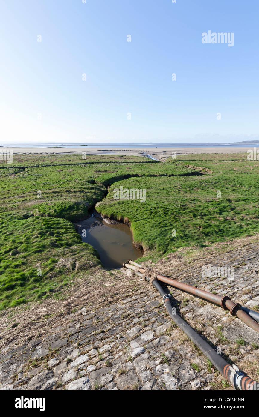Drainage channel in the salt marsh at Grange over Sands, Cumbria, UK ...