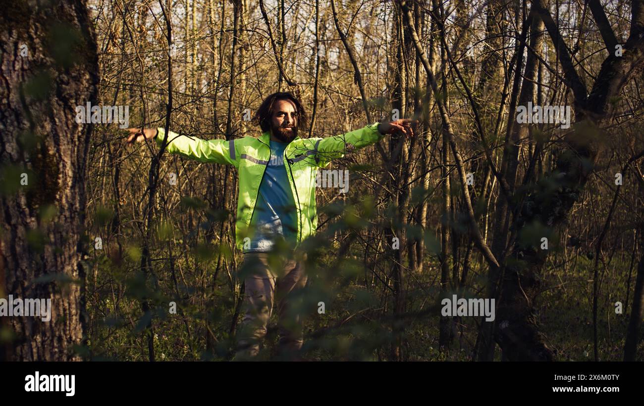 Rescue squad leader guiding route through the woods to collect evidence ...